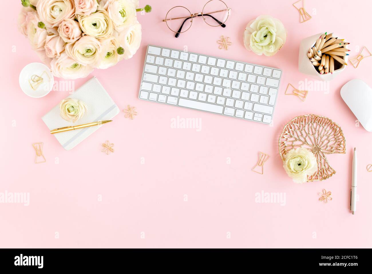 Stylized, pink women's home office desk. Workspace with computer ...