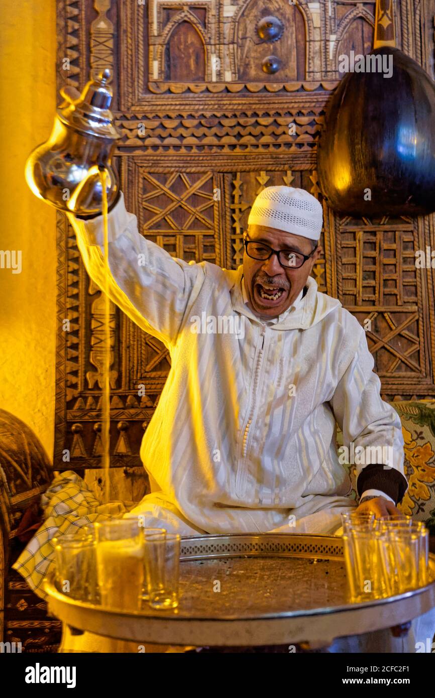 Man pouring tea Stock Photo - Alamy