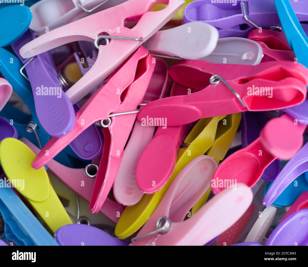 Macro photo of plastic clothes pegs Stock Photo - Alamy