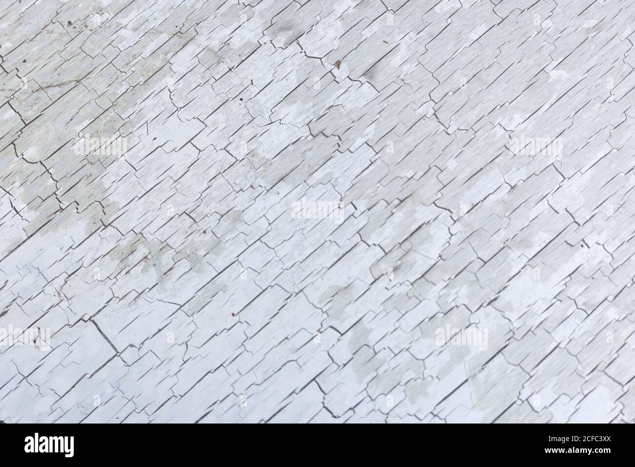 Macro detail of wooden door cracked paint texture. Damaged grey-white ...