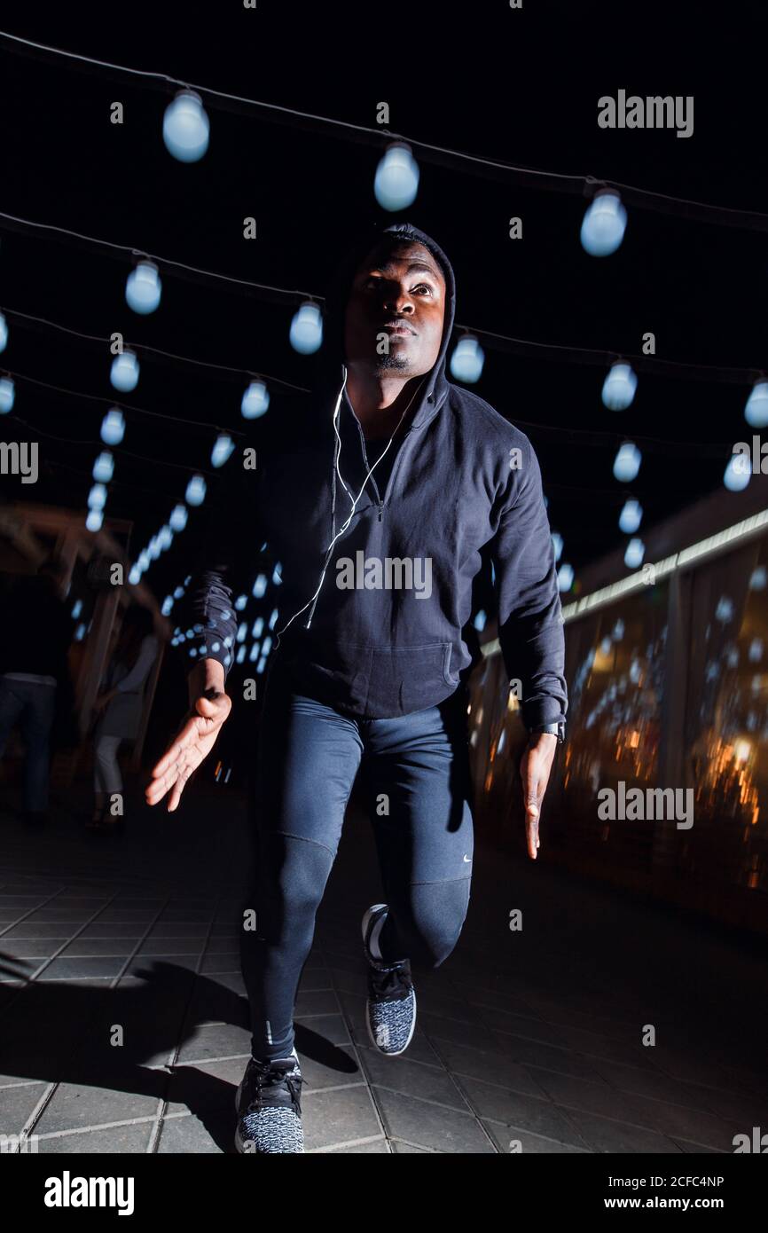 black Man running with flashes of light Stock Photo - Alamy