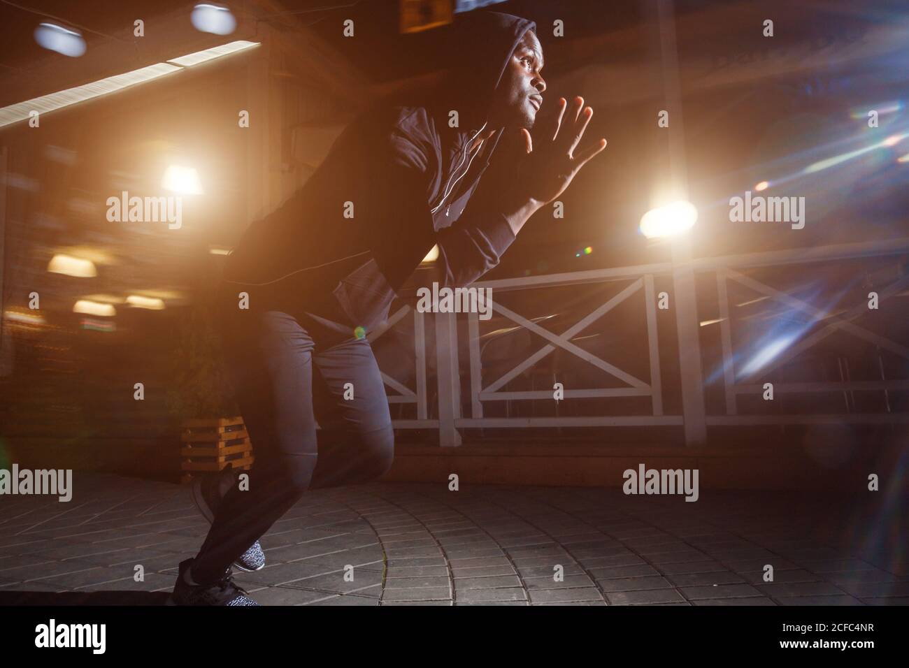 Man running outdoors at twilight, blurred motion Stock Photo - Alamy