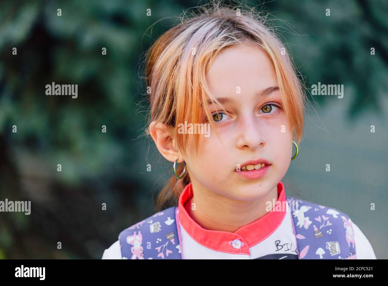 A portrait of a 9 almost 10 year old girl on a neutral background ...