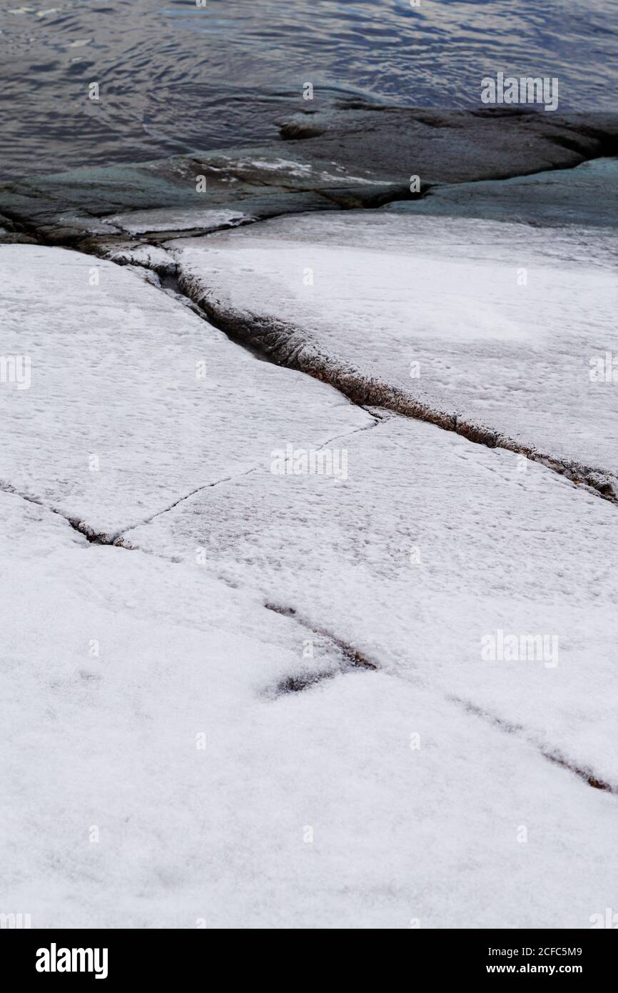 Closeup of processed rock surface with cracks and scratches covered ...