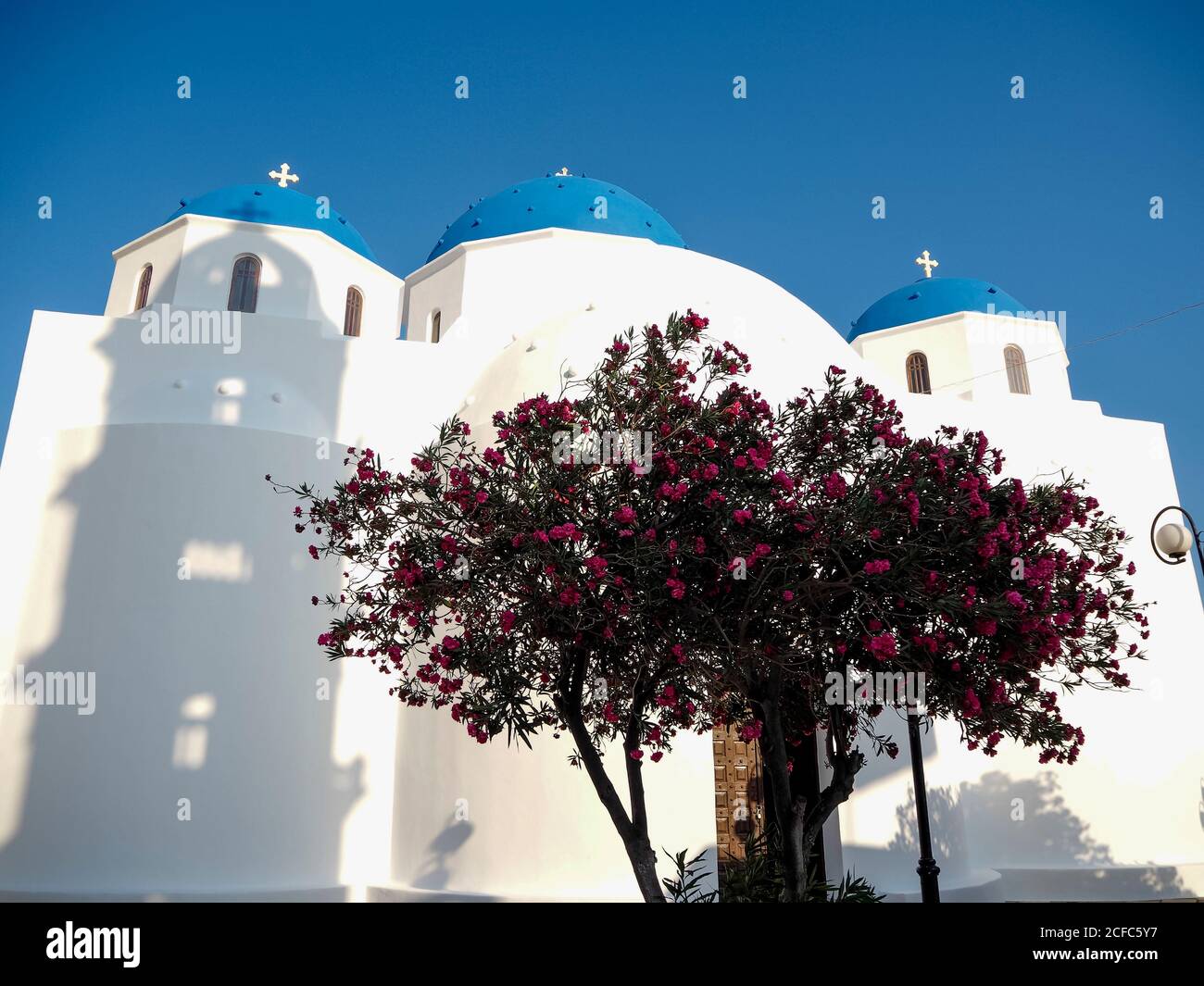Church in Perissa on Santorini Greece with blue dome and white stone ...