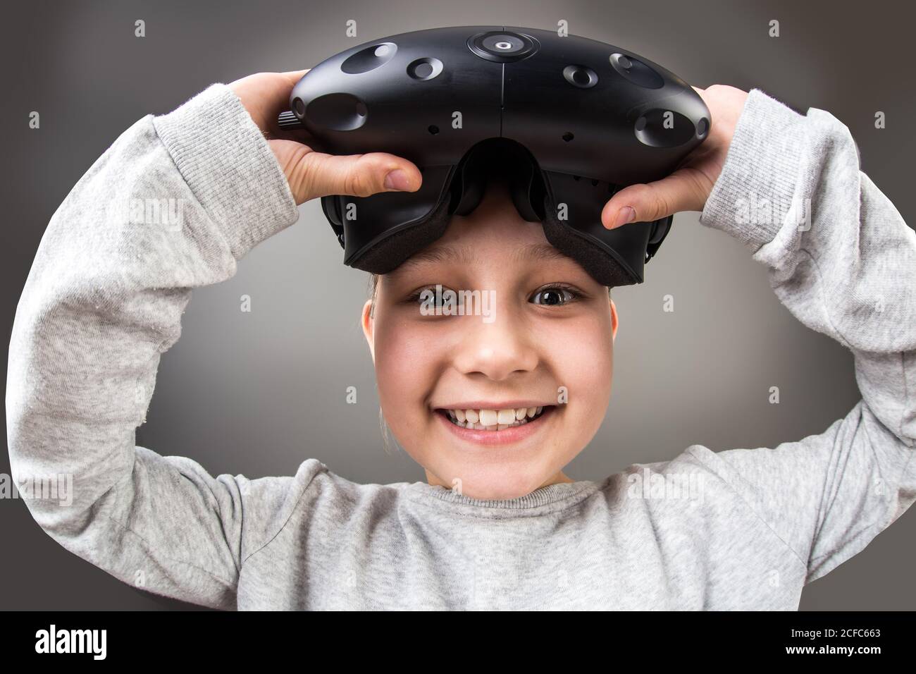 Child remove virtual reality headset Stock Photo - Alamy
