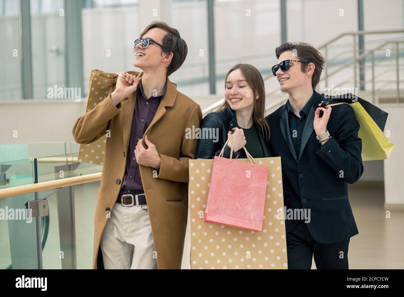 Young shopaholics looking shopping hi-res stock photography and images ...