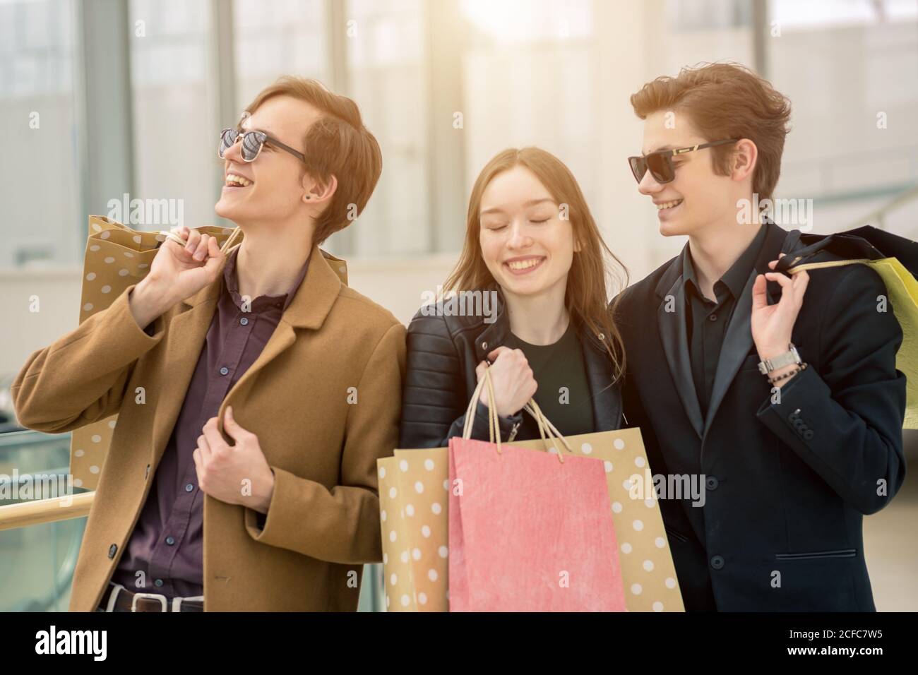 Friends shopping together. Girls there is a sale Stock Photo - Alamy