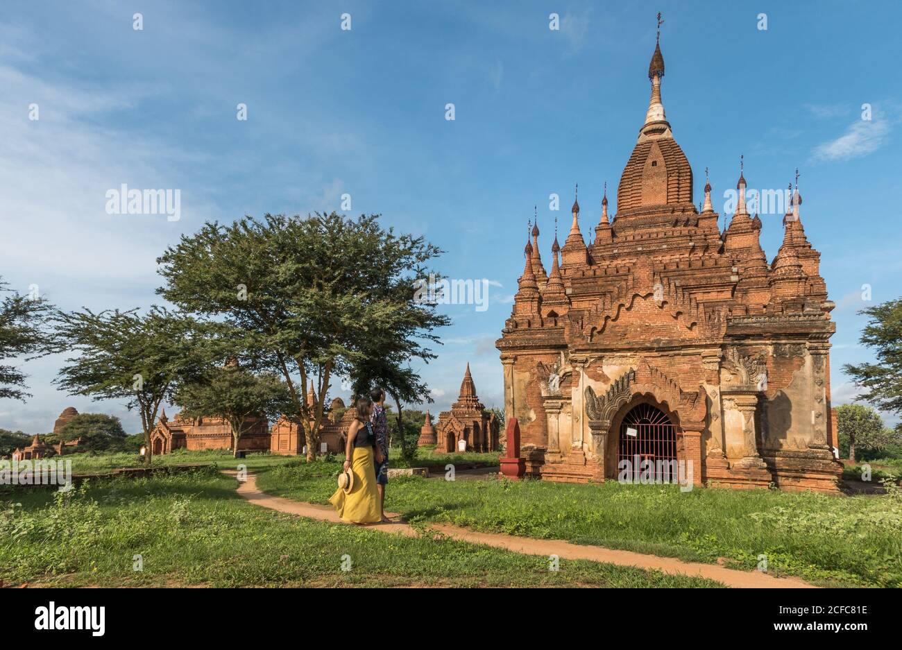 Romantic couple standing in front of old temple Stock Photo - Alamy
