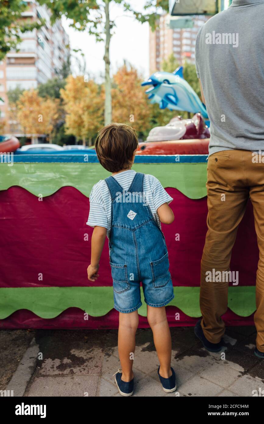 Back view little boy standing hi-res stock photography and images - Alamy