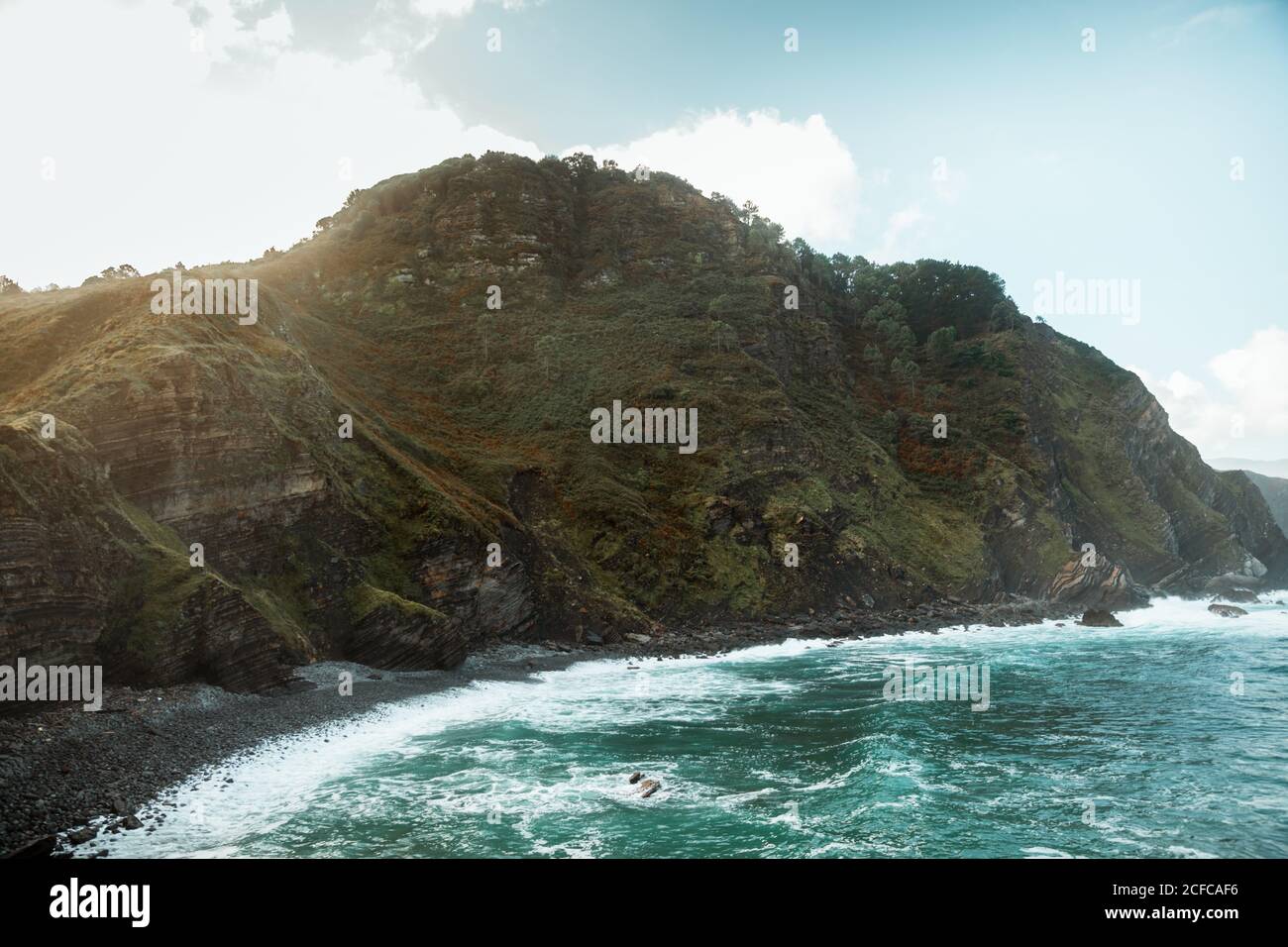 Scenery view of ocean with pure water and waves forming foam while ...