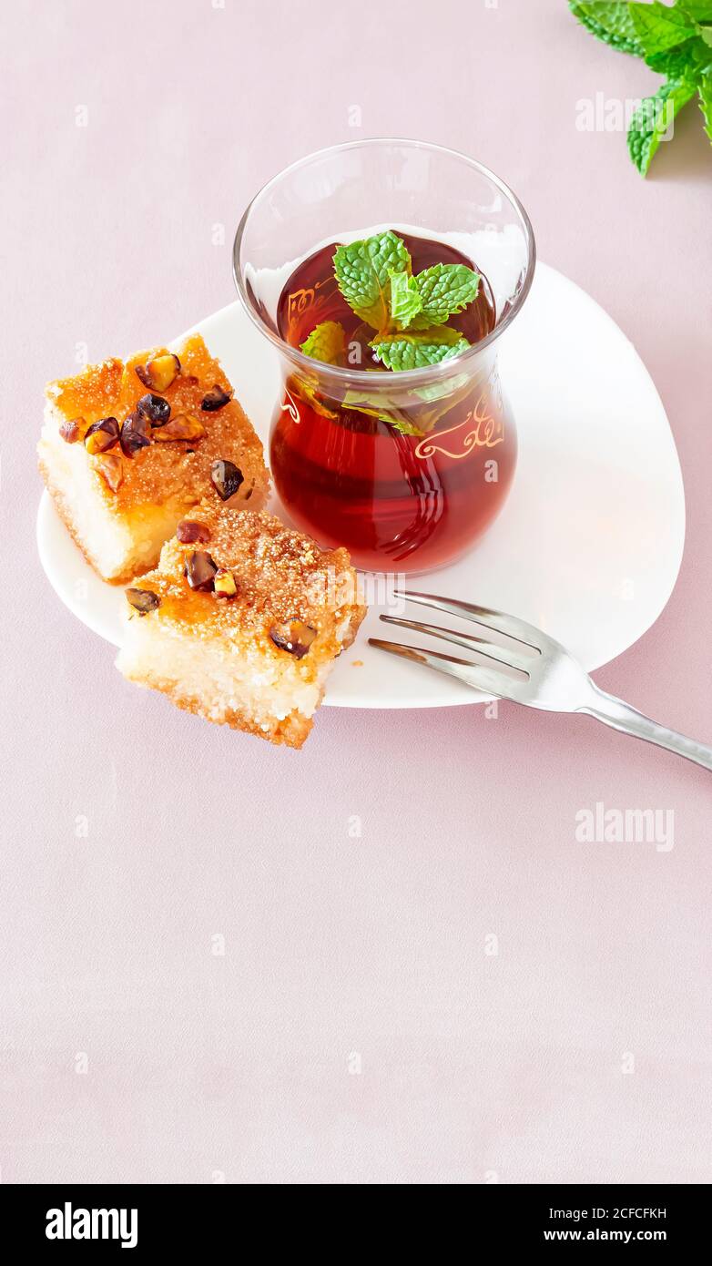 Basbousa (namoora) traditional arabic semolina cake with almond nut and ...