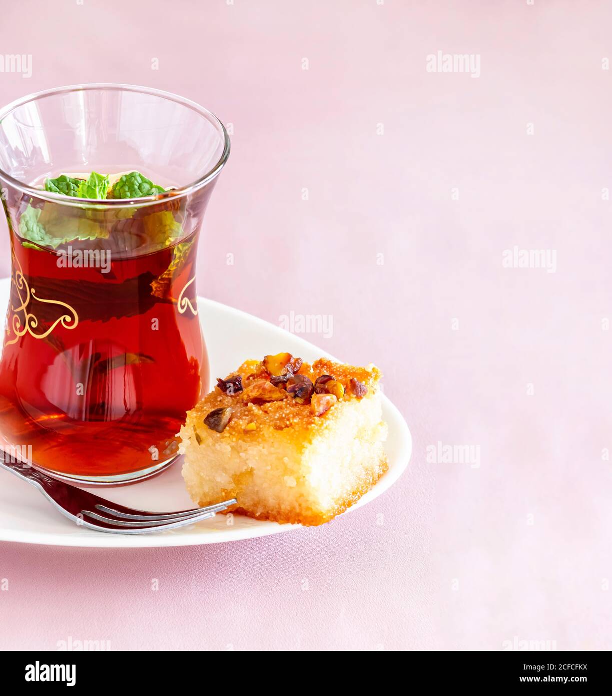Glass of moroccan mint tea with Basbousa (namoora) traditional arabic ...