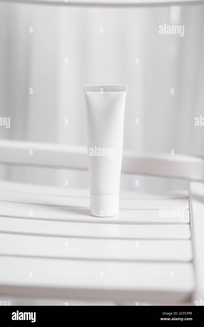 White cosmetic tube on white background, beauty product, brand package ...