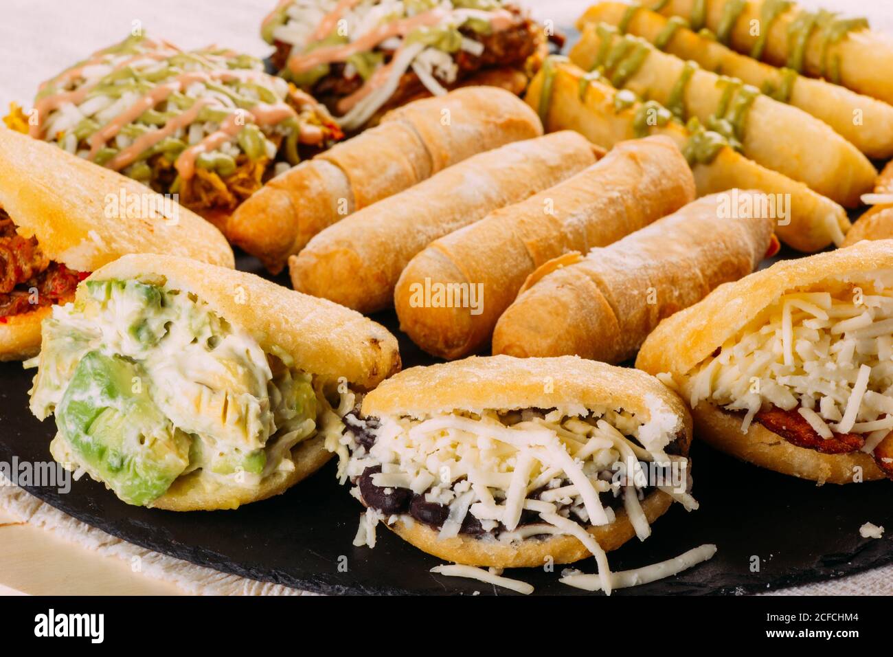 Venezuelan food tasting dish, the dish has arepas, tequeños, yuca and ...