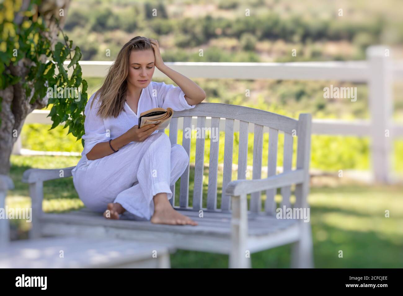Beautiful Girl Reading Book Outdoors. Nice Female Spending Leisure Time ...