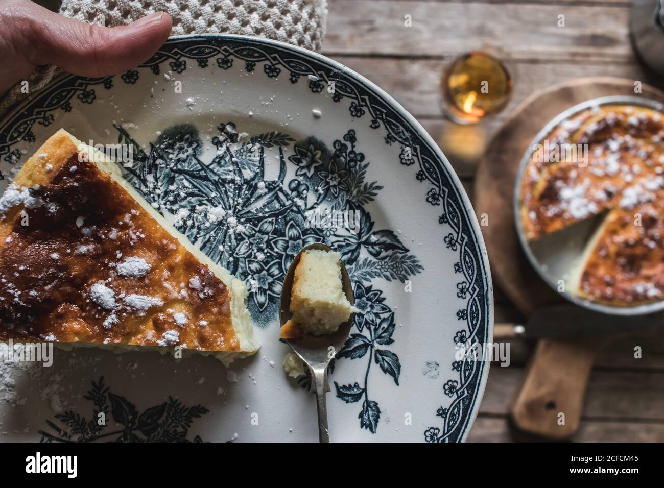 From above cottage cheese baked pudding served on plate and glass of ...