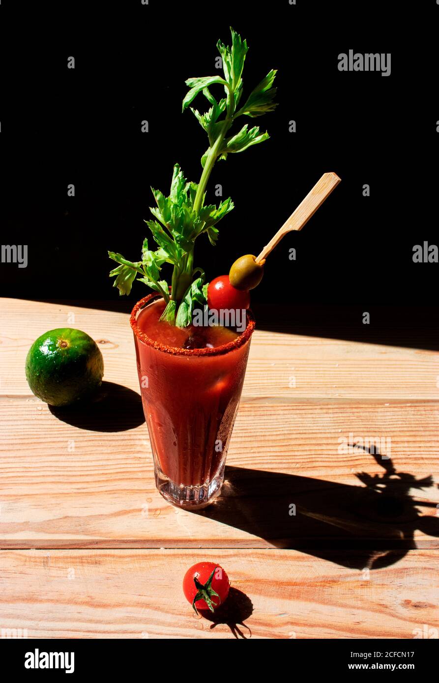 Virgin blood mary placed on a wooden table with black background Stock ...