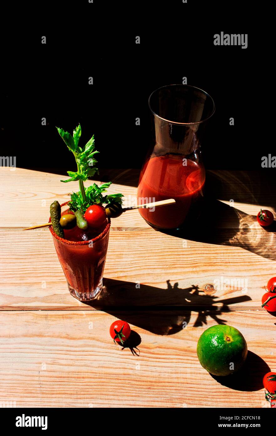 Virgin blood mary placed on a wooden table with black background Stock ...