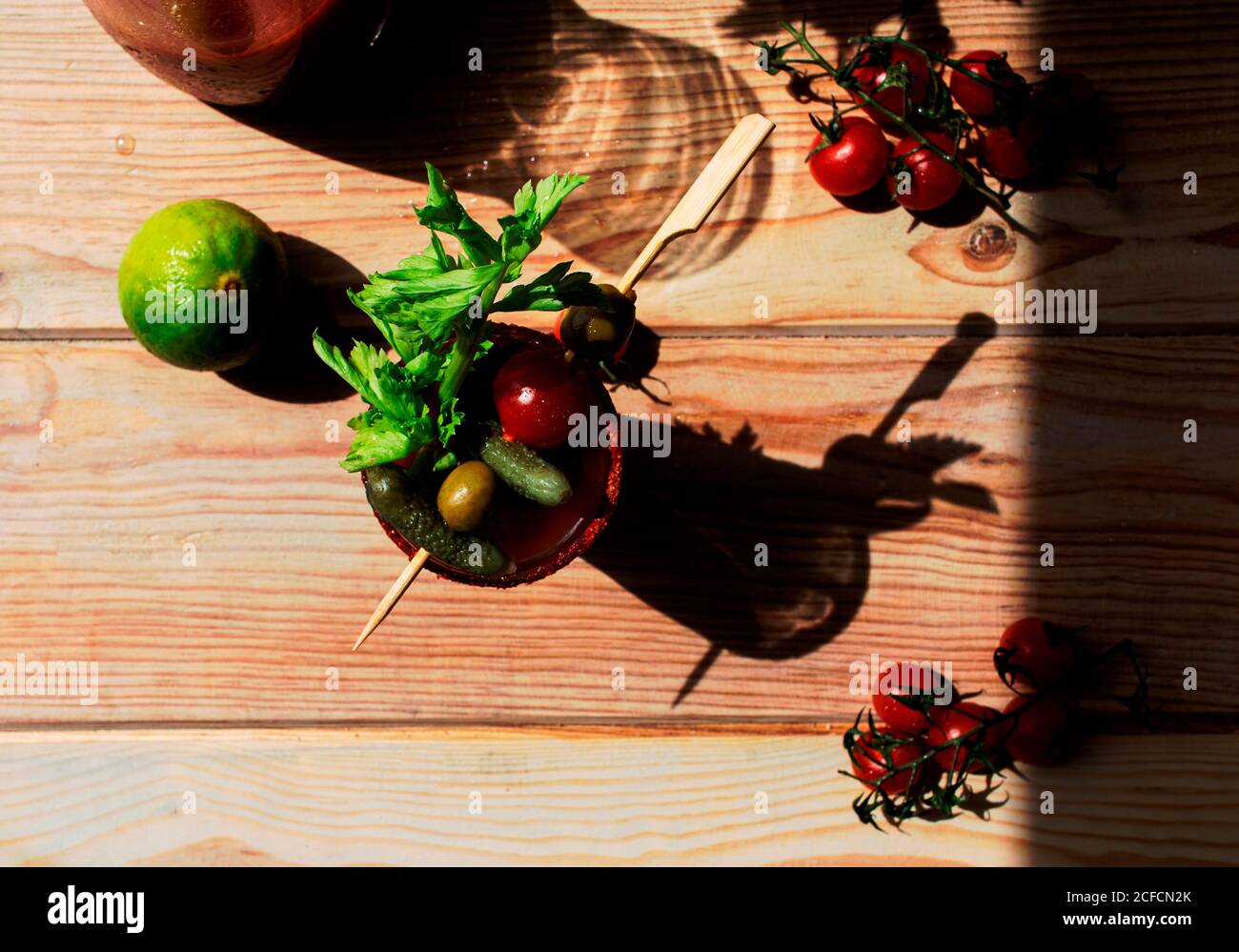 From above top view of fresh virgin blood mary placed on a wooden table ...