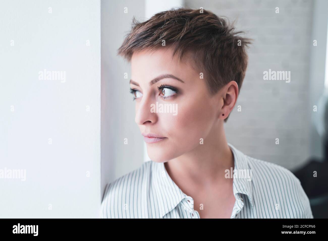 girl posing after cutting her hair Stock Photo - Alamy