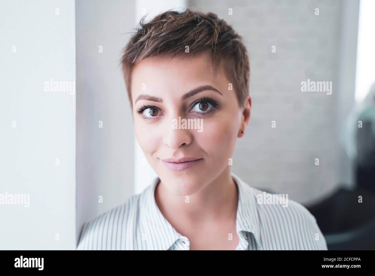girl posing after cutting her hair Stock Photo - Alamy