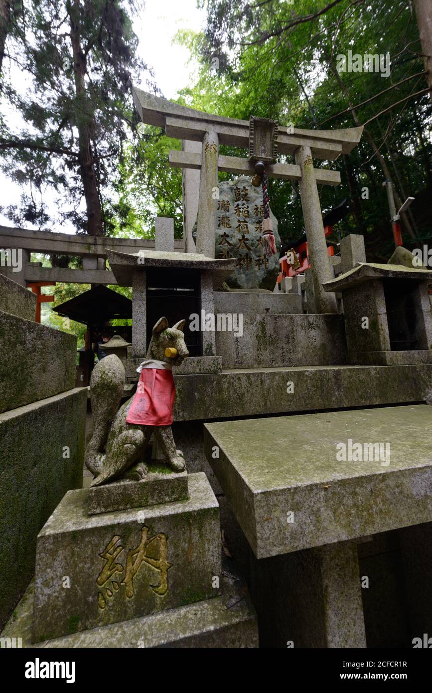 Stone monument and sculpture of traditional guardian dog in ancient ...