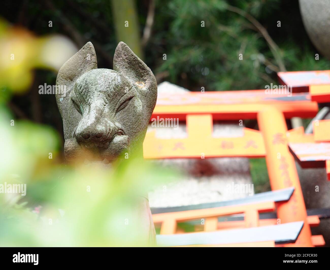 Fox spirit statue outside shrine Stock Photo - Alamy