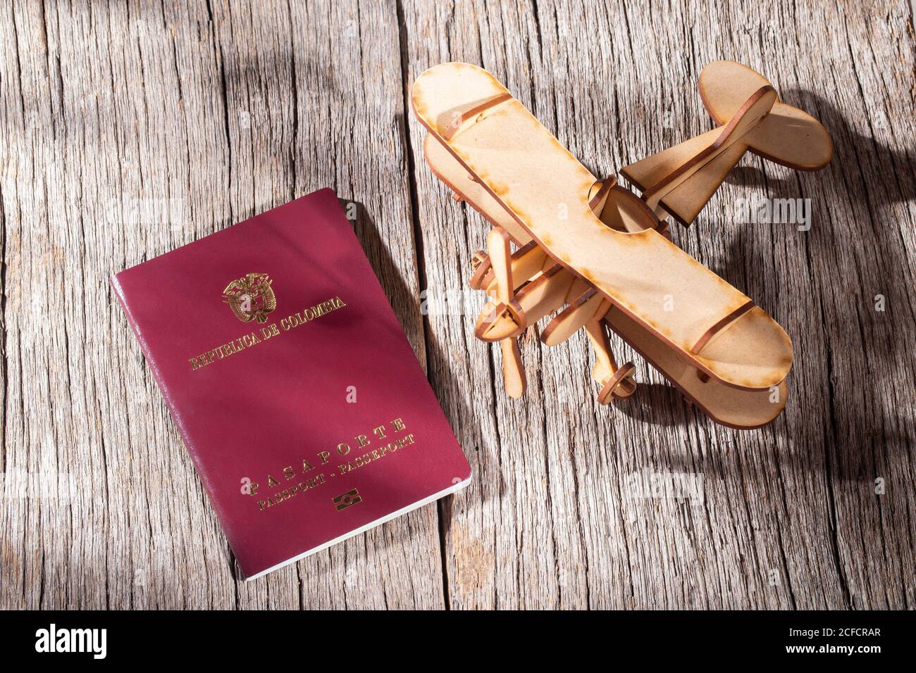 Colombian passport on wooden background close-up image Stock Photo - Alamy