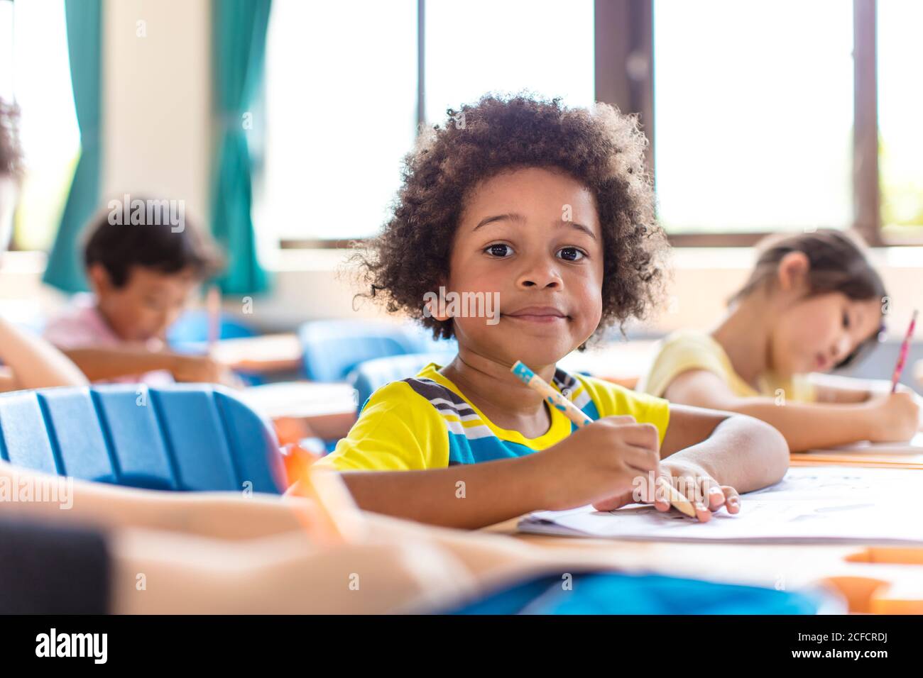 Kid working classroom hi-res stock photography and images - Alamy