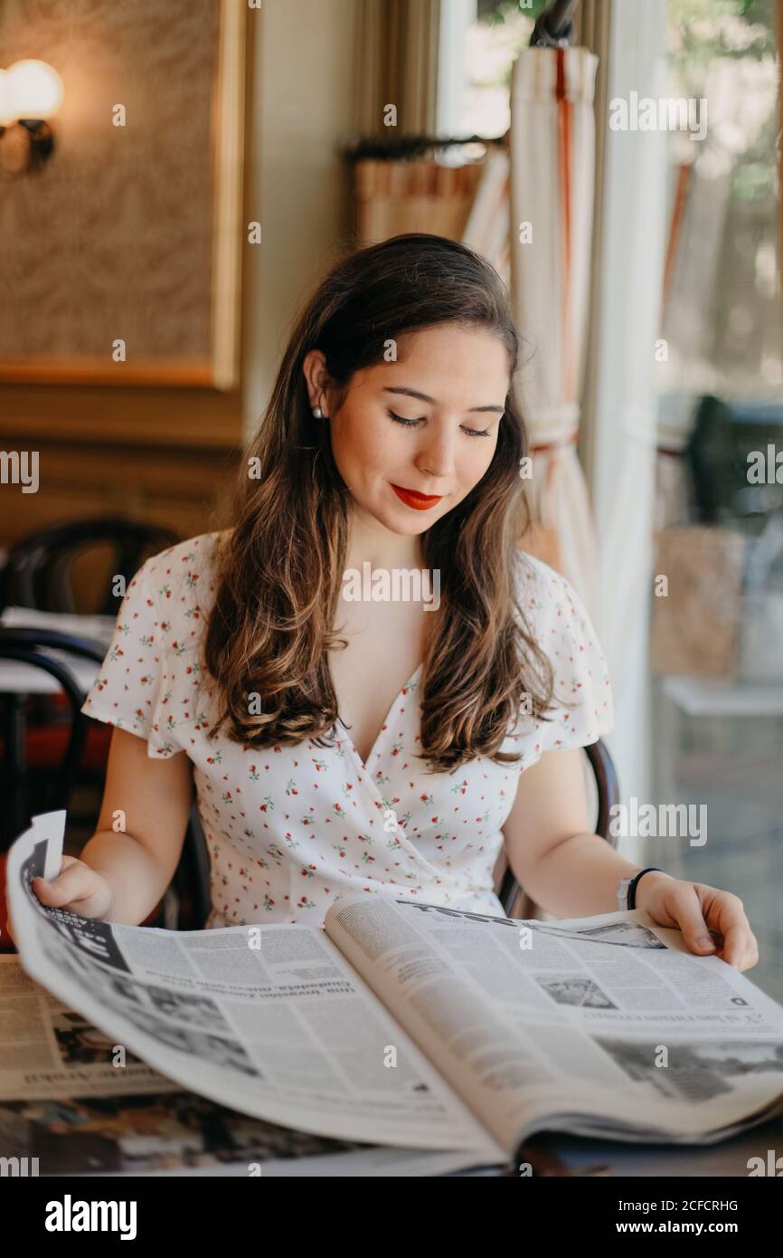 Lady reading a newspaper hi-res stock photography and images - Alamy