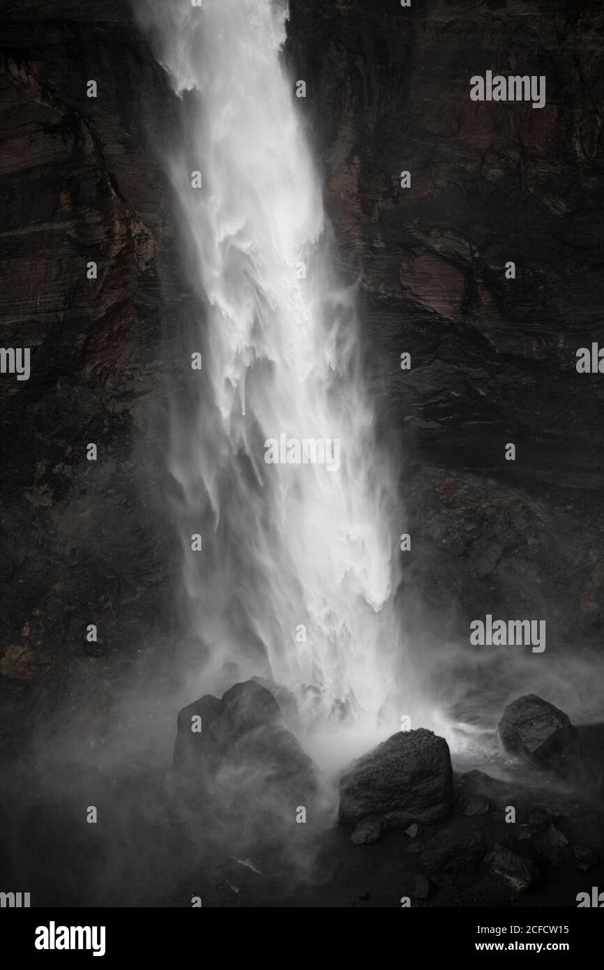 Picturesque landscape of strong waterfall in volcanic rocky location in ...