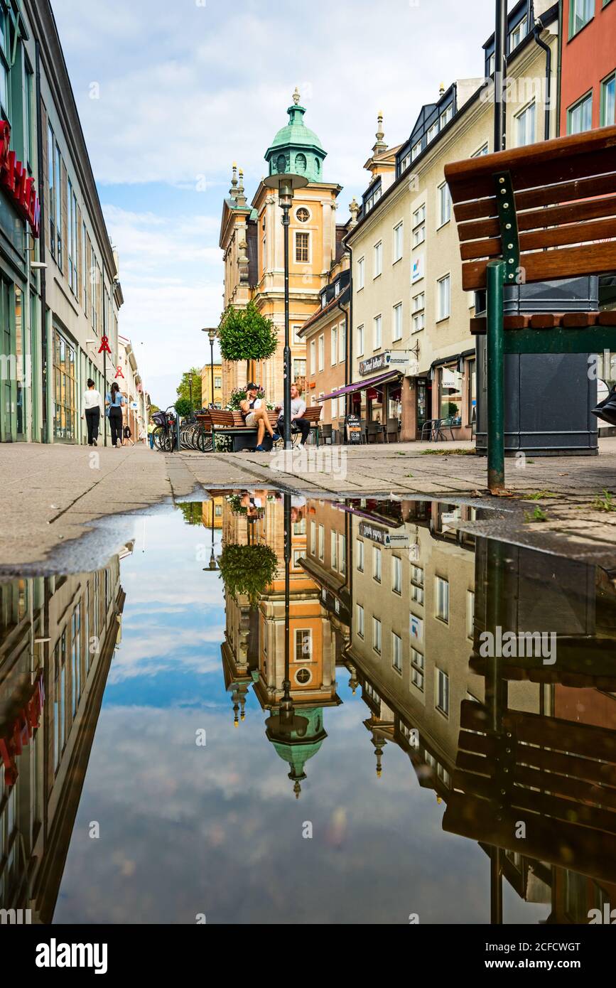The Kalmar Cathedral is reflected in a puddle Stock Photo - Alamy