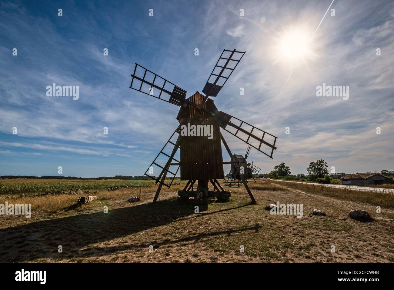 Post windmill on Öland against the light Stock Photo - Alamy