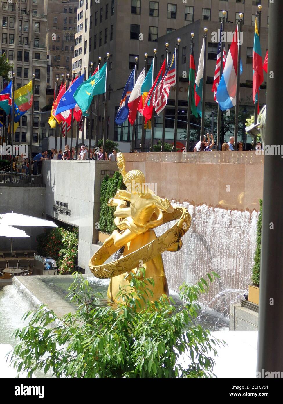 Prometheus statue and flags at Rockefeller Center, New York City ...