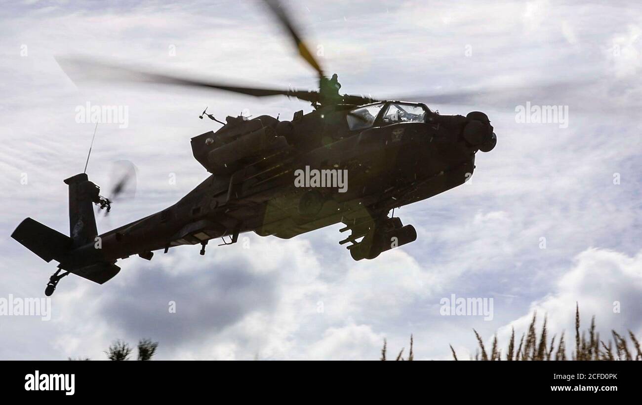 An AH-64 Apache assigned to 101st Combat Aviation Brigade, 101st Airborne Division, assaults ...