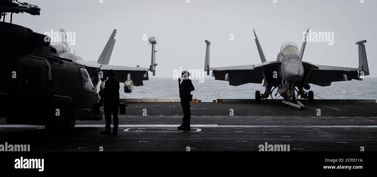 200831-N-ZR324-1032 ARABIAN SEA (Aug. 31, 2020) Sailors move aircraft ...