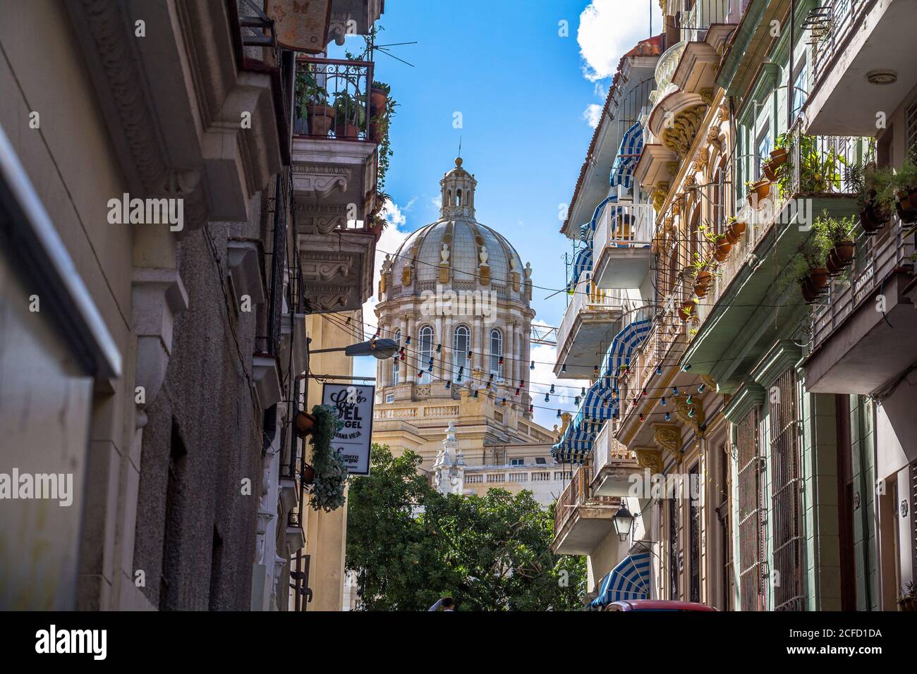 Cuban alley with colonial houses and view of Capitol, Old Havana, Cuba ...