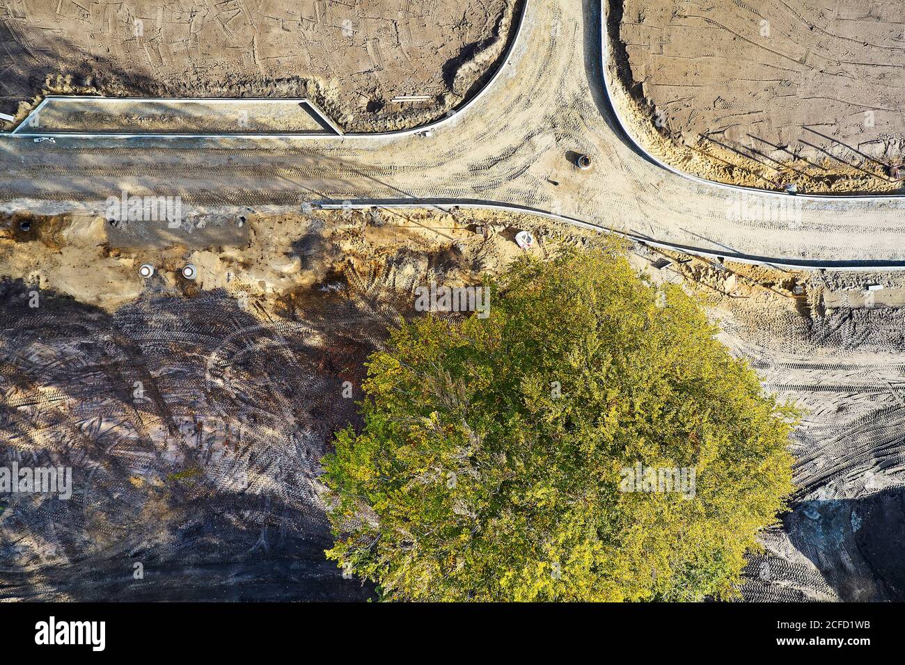 Infrastructure, structures, forms, traces, earth colors, green tree top ...