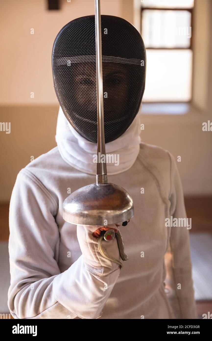 Woman wearing fencing outfit Stock Photo - Alamy