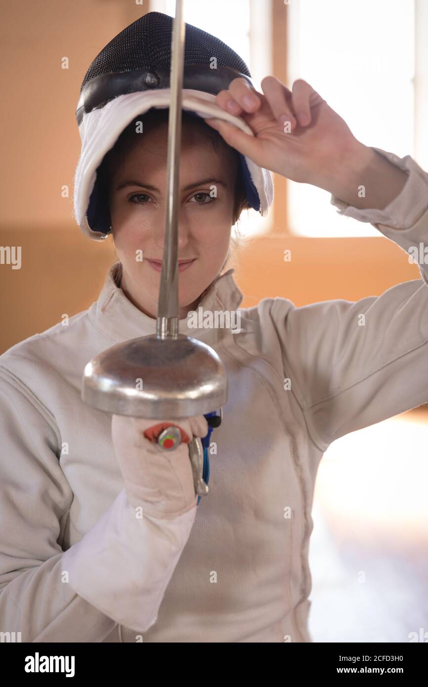 Woman wearing fencing outfit Stock Photo - Alamy