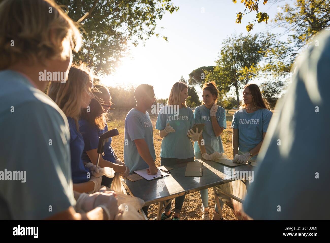Talking around table Stock Photo - Alamy