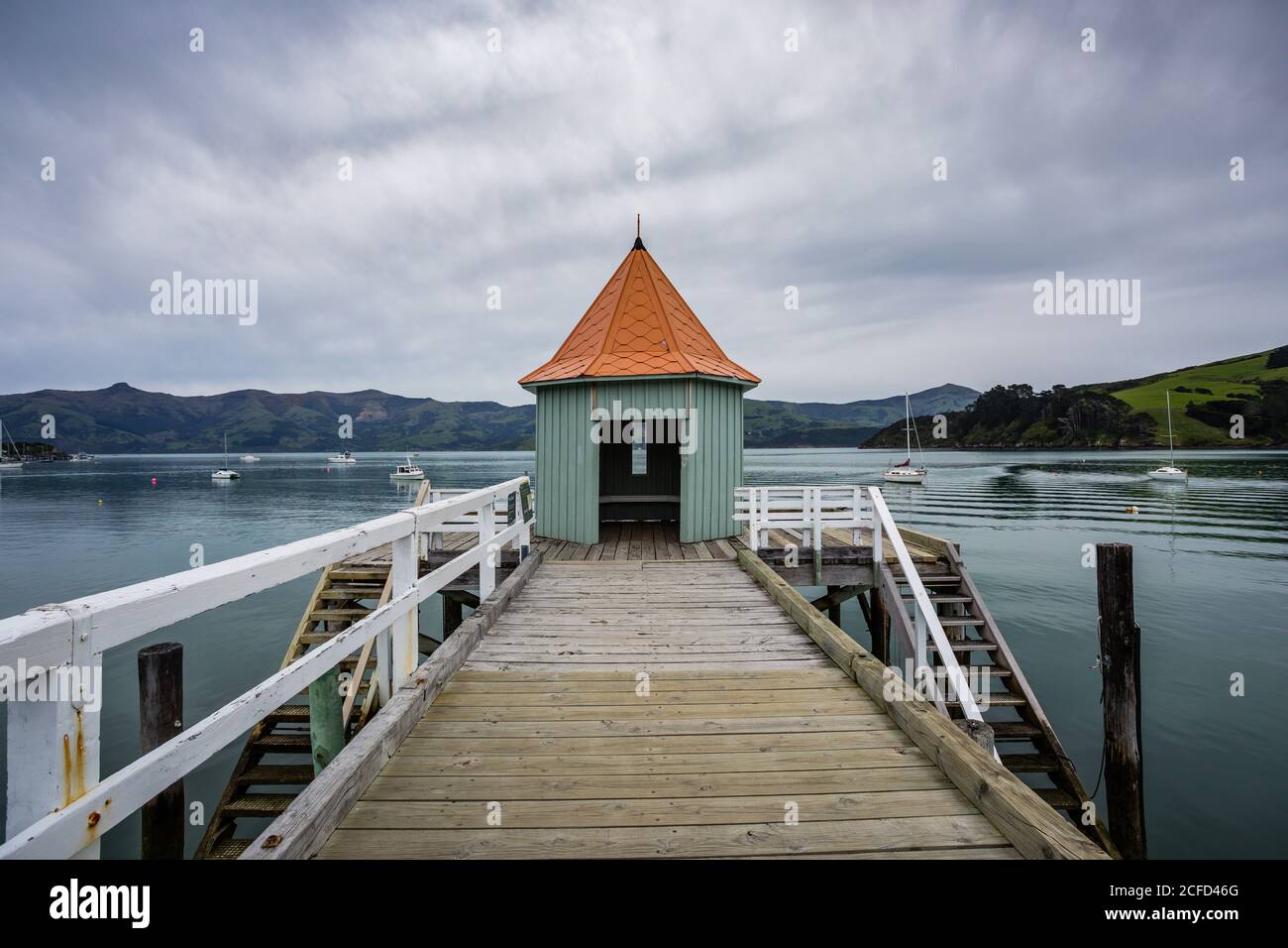 Jetty in Akaroa harbor Stock Photo - Alamy