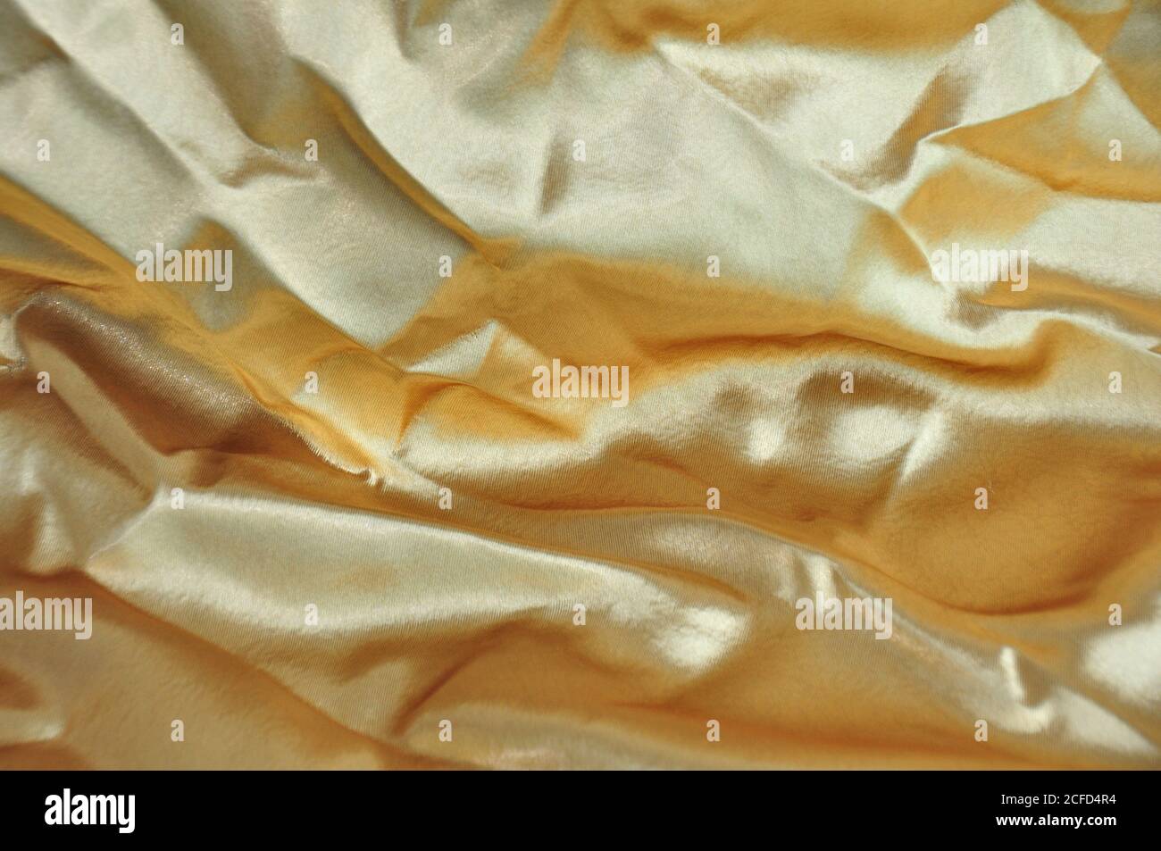 Golden, shiny, reflective, satin material. Golden background ...