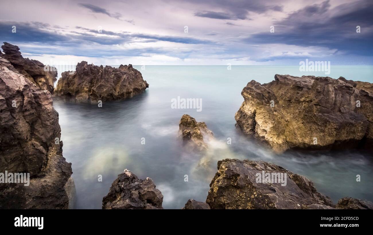 Stone beach at Saint Pierre la Mer in spring Stock Photo - Alamy