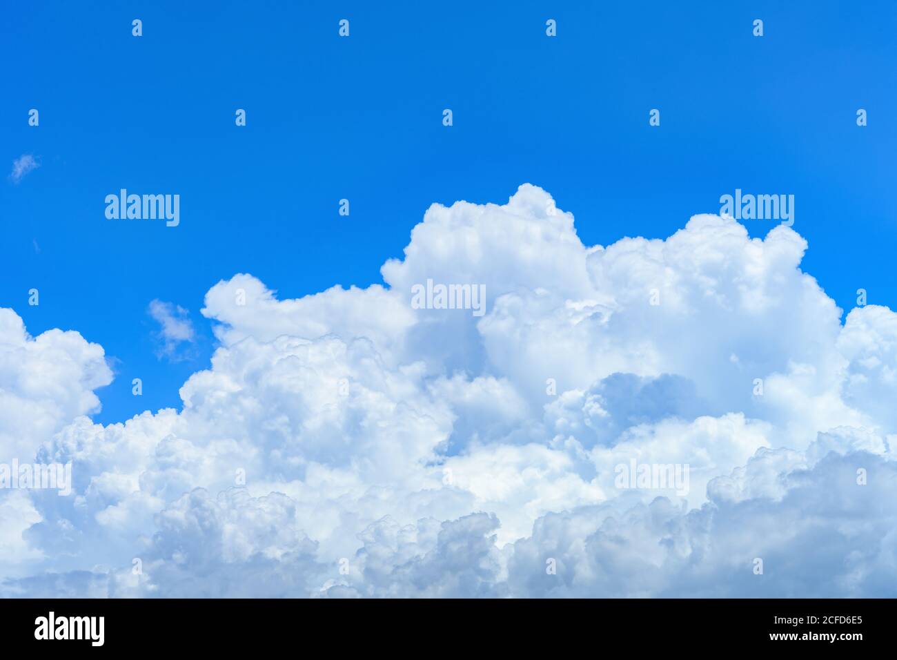 beautiful blue sky with thick white clouds in the noon time horizontal ...
