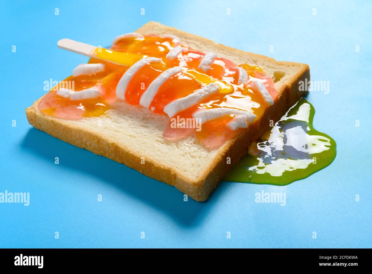 side view lychee and milk and grapefruit flavor popsicle melting on ...