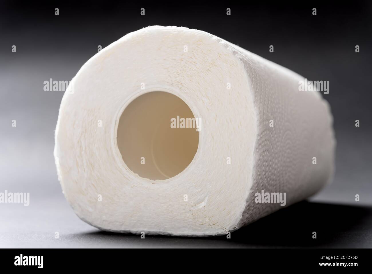 brand new paper roll for kitchen on black background Stock Photo - Alamy
