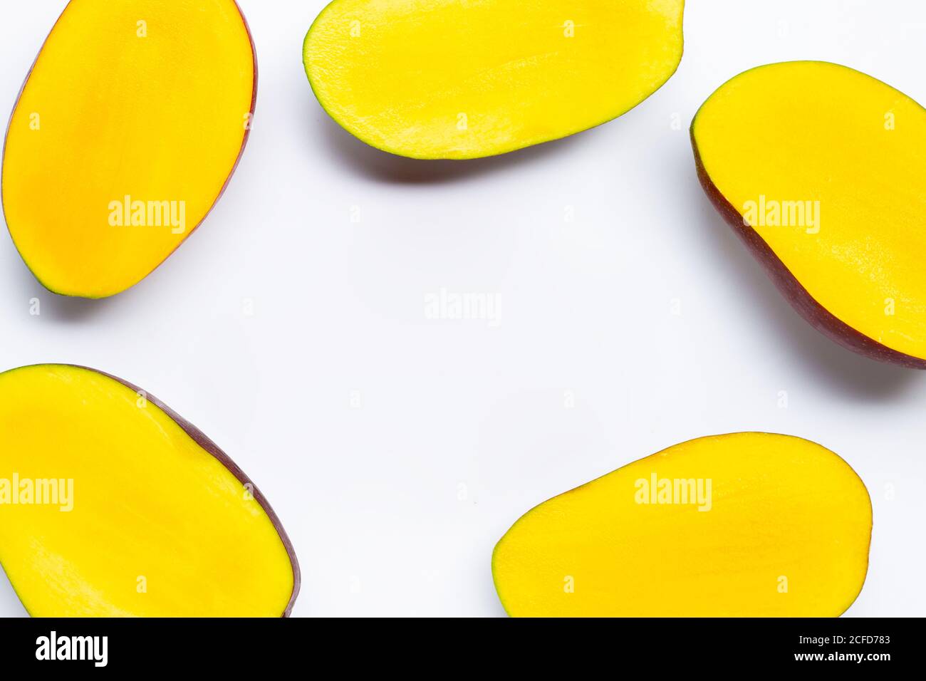 Tropical fruit, Frame made of mango slices on white background. Top ...