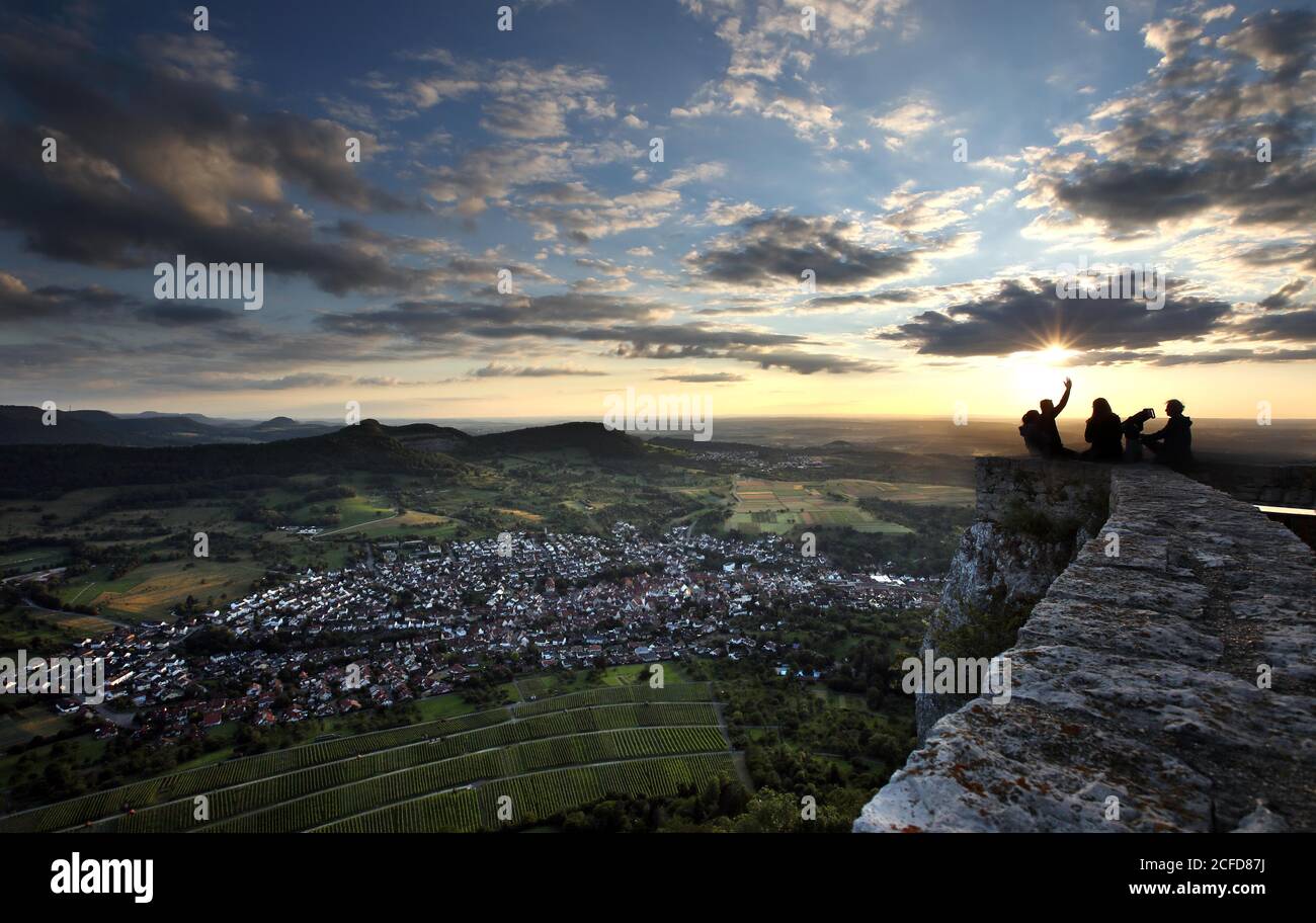Young people experience romantic sunset, Hohenneuffen Castle, Neuffen ...